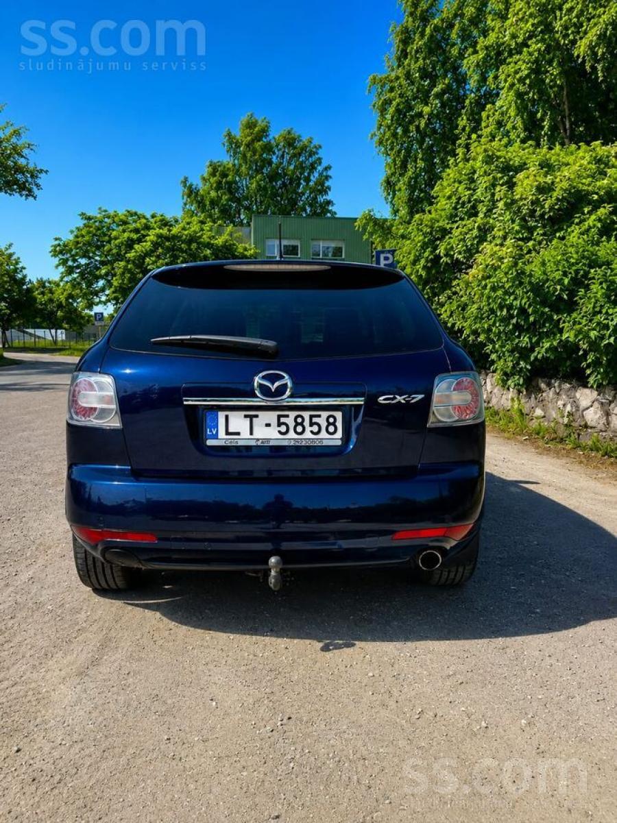 Blue Mazda CX-7 2011 in Cesis, with an engine capacity of 2.20 L and mileage of 235 thousand km for 5199 €, photo 4 on AUTOMOTO.COM.LV