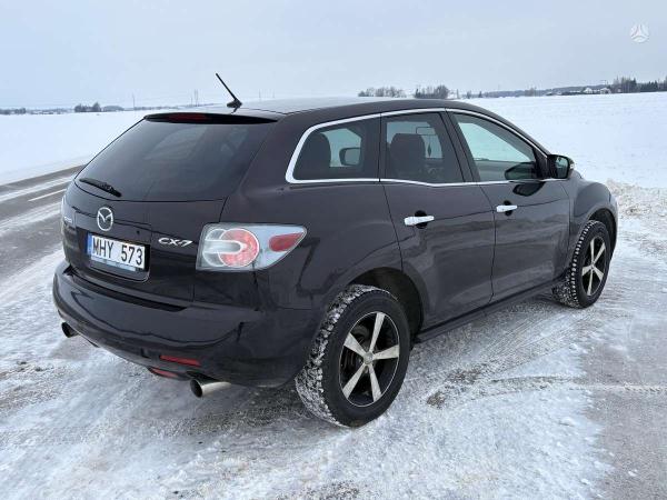 Red Mazda CX-7 2007 in Joniskis, with an engine capacity of 2.26 L and mileage of 199 thousand km for 1849 €, photo 4 on AUTOMOTO.COM.LV