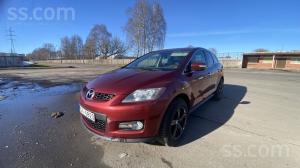 Red Mazda CX-7 2007 in Riga, with an engine capacity of 2.30 L and mileage of 283 thousand km for 1900 €, photo  on AUTOMOTO.COM.LV