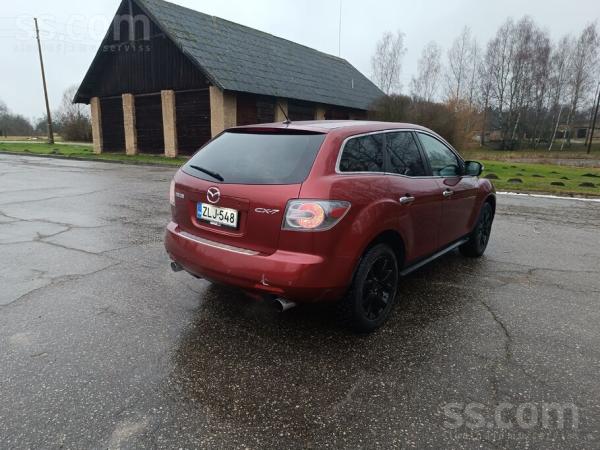 Red Mazda CX-7 2007 in Riga, with an engine capacity of 2.30 L and mileage of 290 thousand km for 1700 €, photo 3 on AUTOMOTO.COM.LV
