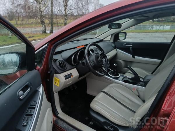Red Mazda CX-7 2007 in Riga, with an engine capacity of 2.30 L and mileage of 290 thousand km for 1700 €, photo 5 on AUTOMOTO.COM.LV