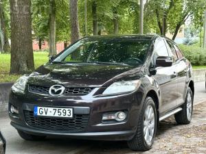 Sarkans Mazda CX-7 2007 Rīga, ar dzinēja tilpumu 2.00 L un nobraukumu 304 tūkst. km par 2400 €, foto  vietnē AUTOMOTO.COM.LV
