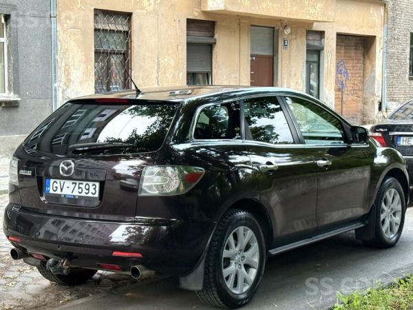 Red Mazda CX-7 2007 in Riga, with an engine capacity of 2.00 L and mileage of 304 thousand km for 2400 €, photo 3 on AUTOMOTO.COM.LV