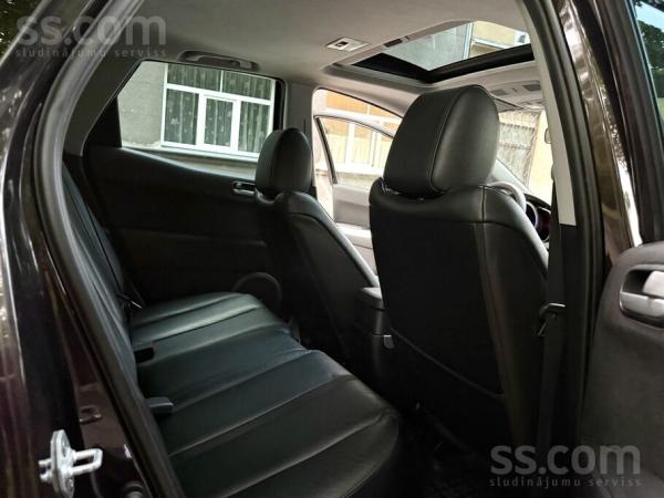 Red Mazda CX-7 2007 in Riga, with an engine capacity of 2.00 L and mileage of 304 thousand km for 2400 €, photo 7 on AUTOMOTO.COM.LV