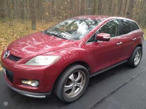 Sarkans Mazda CX-7 2008 Viļņa, ar dzinēja tilpumu 2.30 L un nobraukumu 202 tūkst. km par 1290 €, foto  vietnē AUTOMOTO.COM.LV