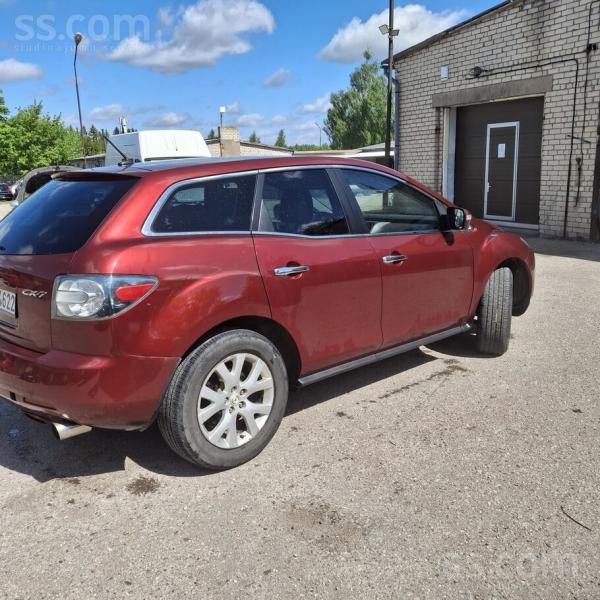 Red Mazda CX-7 2008 in Talsi, with an engine capacity of 2.30 L and mileage of 270 thousand km for 2700 €, photo 4 on AUTOMOTO.COM.LV