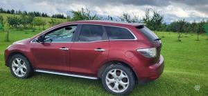 Red Mazda CX-7 2009 in Vilnius, with an engine capacity of 2.18 L and mileage of 303 thousand km for 3400 €, photo 5 on AUTOMOTO.COM.LV