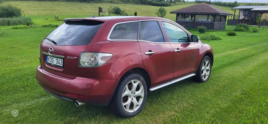 Red Mazda CX-7 2009 in Vilnius, with an engine capacity of 2.18 L and mileage of 303 thousand km for 3400 €, photo 6 on AUTOMOTO.COM.LV