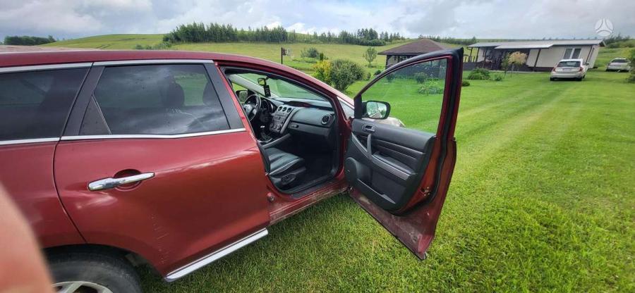 Red Mazda CX-7 2009 in Vilnius, with an engine capacity of 2.18 L and mileage of 303 thousand km for 3400 €, photo 9 on AUTOMOTO.COM.LV