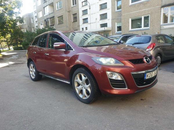 Red Mazda CX-7 2009 in Vilnius, with an engine capacity of 2.18 L and mileage of 303 thousand km for 1800 €, photo 1 on AUTOMOTO.COM.LV