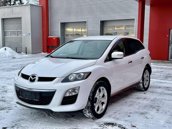 White Mazda CX-7 2010 in Marijampole, with an engine capacity of 2.18 L and mileage of 217 thousand km for 5450 €, photo 1 on AUTOMOTO.COM.LV