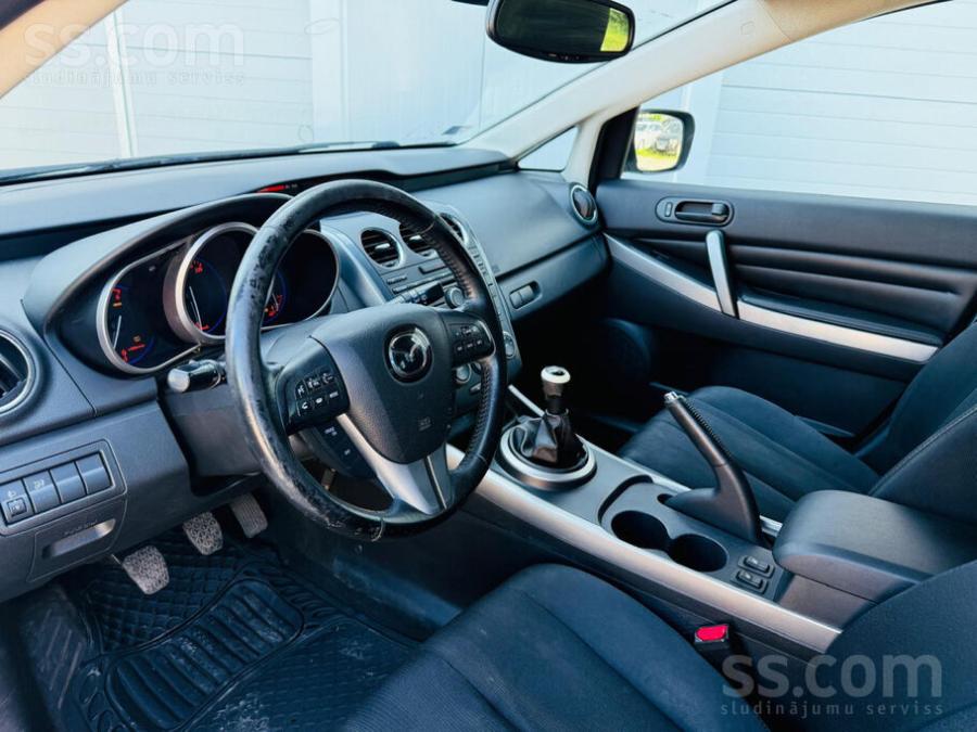 White Mazda CX-7 2010 in Riga, with an engine capacity of 2.00 L and mileage of 247 thousand km for 3400 €, photo 8 on AUTOMOTO.COM.LV