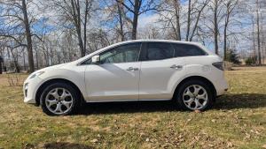 White Mazda CX-7 2011 in Marijampole, with an engine capacity of 2.20 L and mileage of 299 thousand km for 3400 €, photo 3 on AUTOMOTO.COM.LV