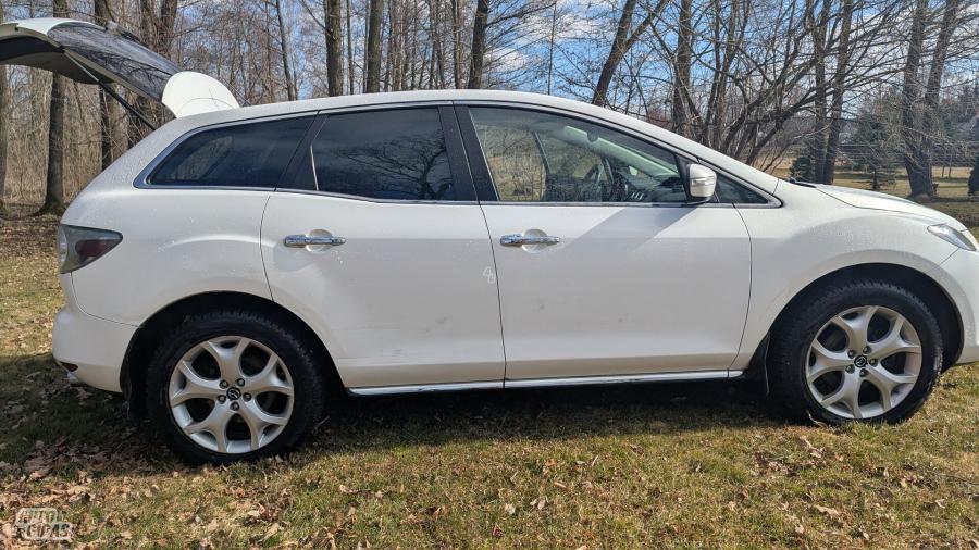 White Mazda CX-7 2011 in Marijampole, with an engine capacity of 2.20 L and mileage of 299 thousand km for 3400 €, photo 4 on AUTOMOTO.COM.LV