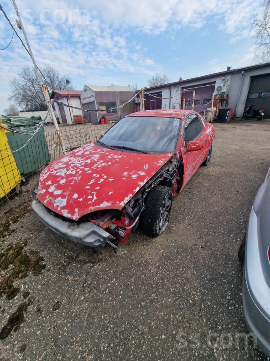 Red Mazda MX-3 1997 in Riga, with an engine capacity of 1.60 L and mileage of 246 thousand km for 350 €, photo 1 on AUTOMOTO.COM.LV