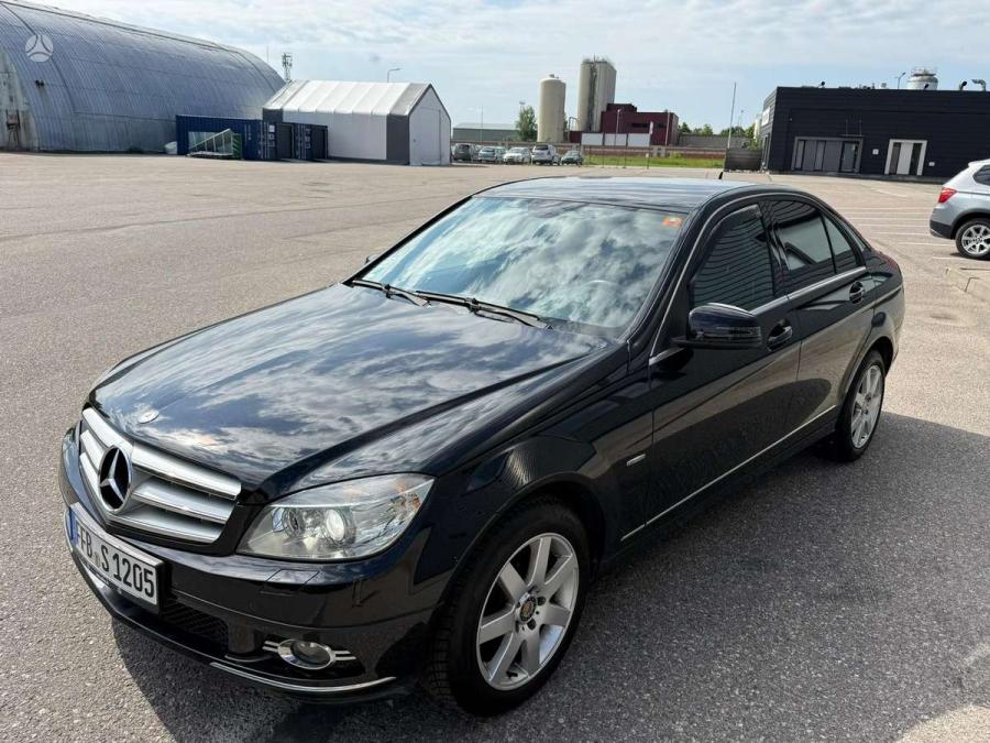 Black Mercedes-Benz C 180 2010 in Kaunas, with an engine capacity of 1.80 L and mileage of 256 thousand km for 5500 €, photo 1 on AUTOMOTO.COM.LV