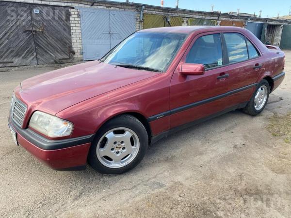 Red Mercedes-Benz C 180 1994 in Riga, with an engine capacity of 1.80 L and mileage of 238 thousand km for 1000 €, photo 4 on AUTOMOTO.COM.LV
