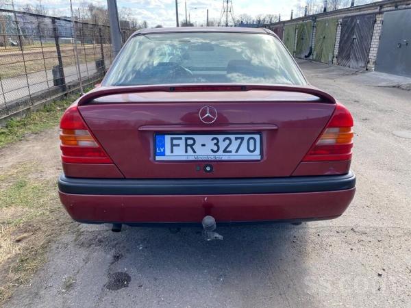 Red Mercedes-Benz C 180 1994 in Riga, with an engine capacity of 1.80 L and mileage of 238 thousand km for 1000 €, photo 6 on AUTOMOTO.COM.LV