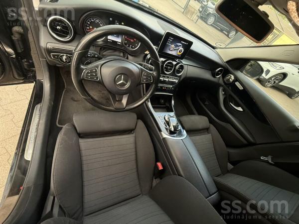 Black Mercedes-Benz C 200 2015 in Dobele, with an engine capacity of 1.60 L and mileage of 254 thousand km for 8990 €, photo 10 on AUTOMOTO.COM.LV