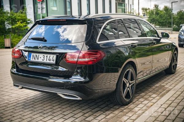 Black Mercedes-Benz C 200 2019 in Riga, with an engine capacity of 1.60 L and mileage of 185 thousand km for 14990 €, photo 4 on AUTOMOTO.COM.LV