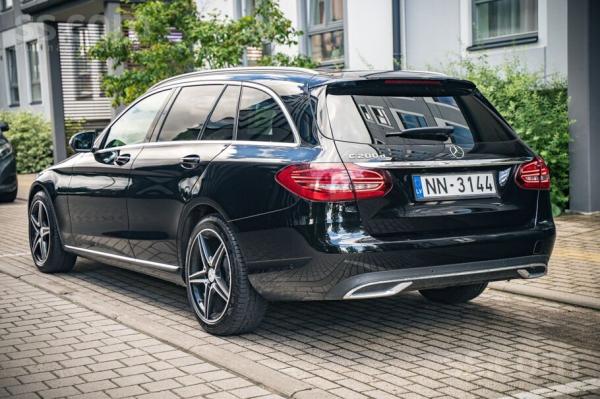 Black Mercedes-Benz C 200 2019 in Riga, with an engine capacity of 1.60 L and mileage of 185 thousand km for 14990 €, photo 6 on AUTOMOTO.COM.LV