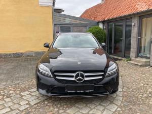 Black Mercedes-Benz C 200 2021 in Kaunas, with an engine capacity of 1.60 L and mileage of 100 thousand km for 23792 €, photo 2 on AUTOMOTO.COM.LV