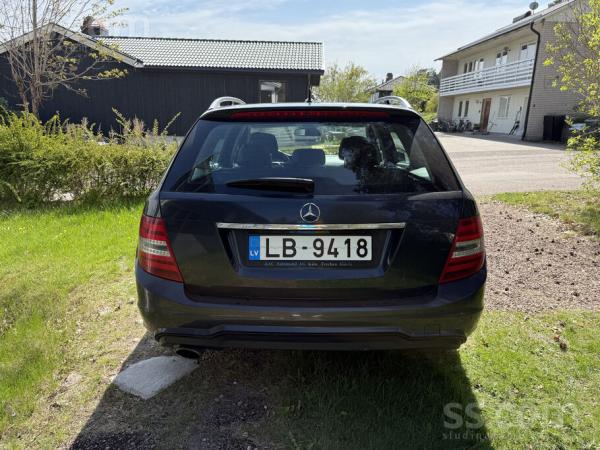 Black Mercedes-Benz C 250 2012 in Riga, with an engine capacity of 2.20 L and mileage of 264 thousand km for 6990 €, photo 4 on AUTOMOTO.COM.LV