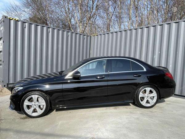 Black Mercedes-Benz C 300 2017 in Vilnius, with an engine capacity of 2.14 L and mileage of 206 thousand km for 13900 €, photo 2 on AUTOMOTO.COM.LV