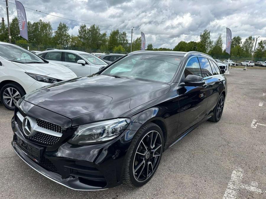 Black Mercedes-Benz C 300 2018 in Panevezys, with an engine capacity of 2.00 L and mileage of 228 thousand km for 19999 €, photo 1 on AUTOMOTO.COM.LV