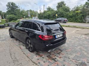 Black Mercedes-Benz C 300 2020 in Ogre, with an engine capacity of 2.00 L and mileage of 245 thousand km for 17500 €, photo 4 on AUTOMOTO.COM.LV