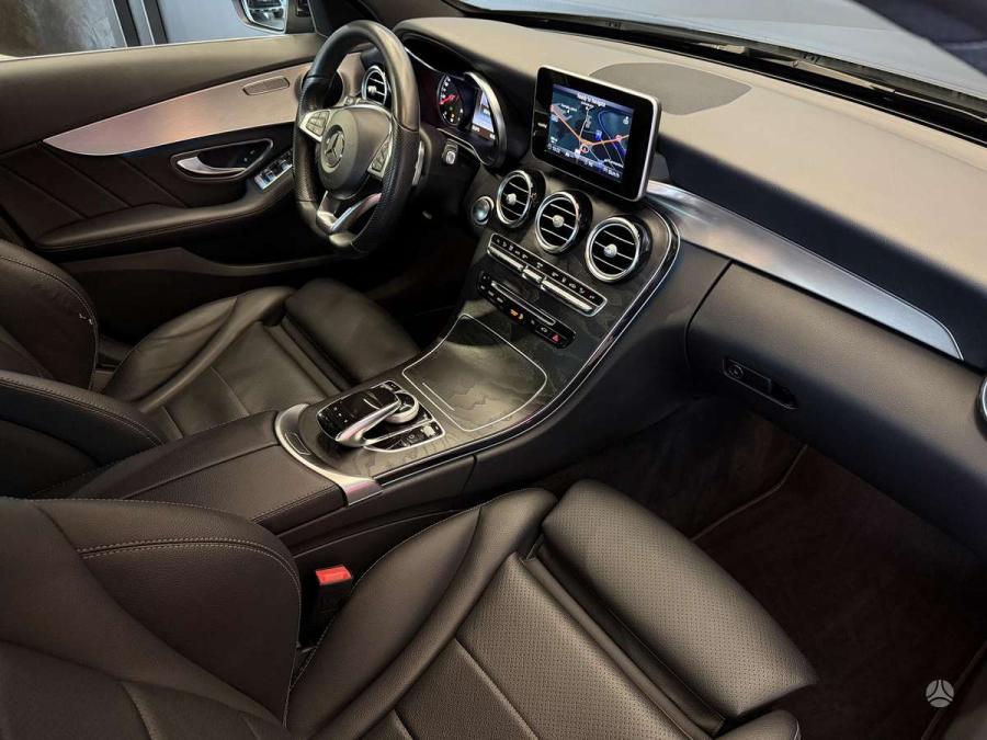 Black Mercedes-Benz C 350 2018 in Kaunas, with an engine capacity of 1.99 L and mileage of 156 thousand km for 17490 €, photo 18 on AUTOMOTO.COM.LV