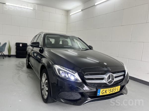 Black Mercedes-Benz C 350 2015 in Limbazi, with an engine capacity of 2.00 L and mileage of 223 thousand km for 11945 €, photo 1 on AUTOMOTO.COM.LV