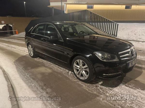 Black Mercedes-Benz C-Class 2011 in Tallinn, with an engine capacity of 1.80 L and mileage of 127 thousand km for 6899 €, photo 1 on AUTOMOTO.COM.LV