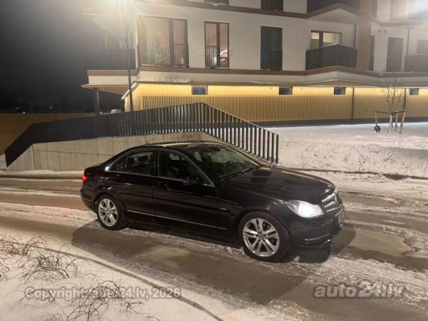 Black Mercedes-Benz C-Class 2011 in Tallinn, with an engine capacity of 1.80 L and mileage of 127 thousand km for 6899 €, photo 2 on AUTOMOTO.COM.LV