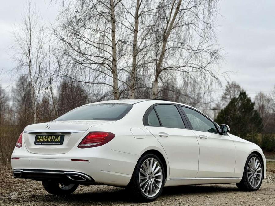 White Mercedes-Benz E 300 2019 in Siauliai, with an engine capacity of 2.00 L and mileage of 158 thousand km for 24999 €, photo 4 on AUTOMOTO.COM.LV