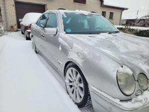 Grey Mercedes-Benz e-43-amg 1998 in Marijampole, with an engine capacity of 4.30 L and mileage of 231 thousand km for 4999 €, photo  on AUTOMOTO.COM.LV