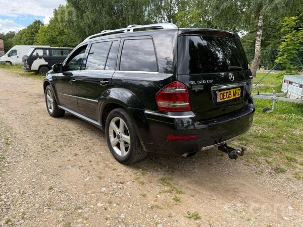 Black Mercedes-Benz GL 320 2009 in Ogre, with an engine capacity of 3.00 L and mileage of 188 thousand km for 4000 €, photo 3 on AUTOMOTO.COM.LV