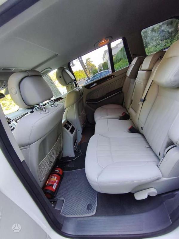 White Mercedes-Benz GL 450 2013 in Vilnius, with an engine capacity of 4.66 L and mileage of 258 thousand km for 14000 €, photo 6 on AUTOMOTO.COM.LV