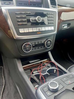 Black Mercedes-Benz gl-550 2013 in Plunge, with an engine capacity of 4.66 L and mileage of 202 thousand km for 12990 €, photo 14 on AUTOMOTO.COM.LV