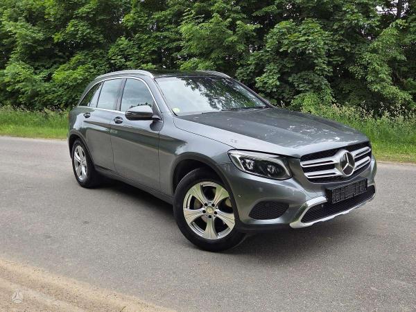 Grey Mercedes-Benz GLC 250 2016 in Kaunas, with an engine capacity of 2.14 L and mileage of 210 thousand km for 15989 €, photo 1 on AUTOMOTO.COM.LV