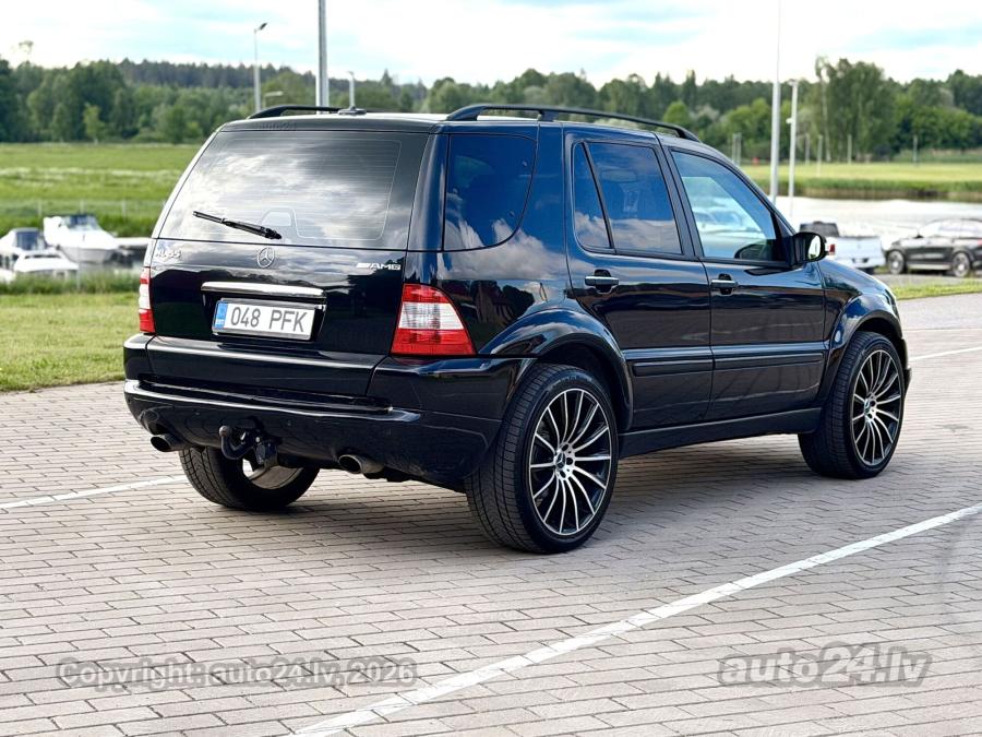 Black Mercedes-Benz M-Class 2006 in Tallinn, with an engine capacity of 5.40 L and mileage of 211 thousand km for 7999 €, photo 4 on AUTOMOTO.COM.LV