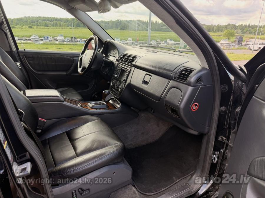 Black Mercedes-Benz M-Class 2006 in Tallinn, with an engine capacity of 5.40 L and mileage of 211 thousand km for 7999 €, photo 9 on AUTOMOTO.COM.LV