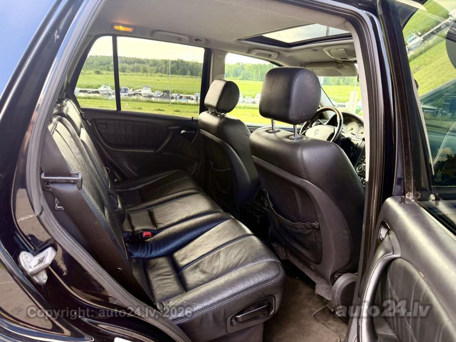 Black Mercedes-Benz M-Class 2006 in Tallinn, with an engine capacity of 5.40 L and mileage of 211 thousand km for 7999 €, photo 11 on AUTOMOTO.COM.LV