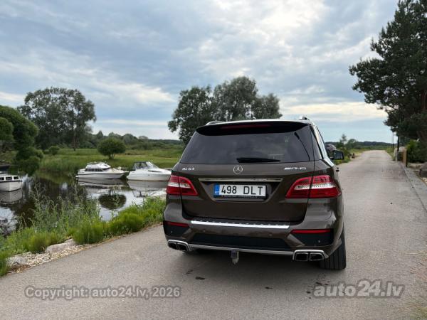 Brown Mercedes-Benz M-Class 2013 in Tallinn, with an engine capacity of 5.50 L and mileage of 240 thousand km for 26990 €, photo 7 on AUTOMOTO.COM.LV