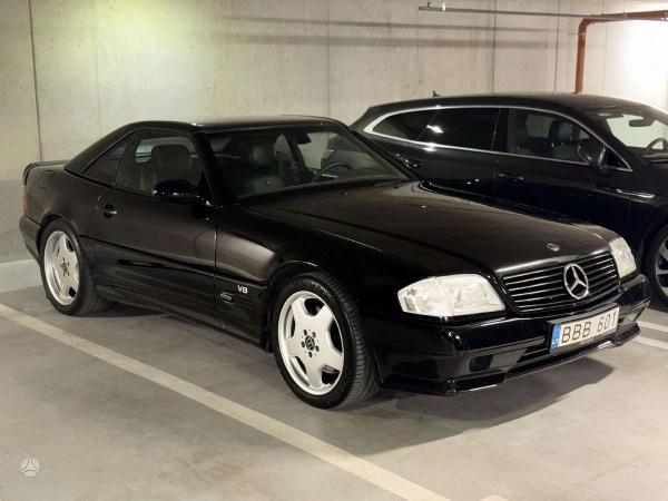 Black Mercedes-Benz SL 500 1999 in Vilnius, with an engine capacity of 5.03 L and mileage of 67 thousand km for 19800 €, photo 1 on AUTOMOTO.COM.LV