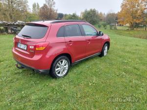 Sarkans Mitsubishi ASX 2013 Viljandi, ar dzinēja tilpumu 2.30 L un nobraukumu 83 tūkst. km par 12000 €, foto 15 vietnē AUTOMOTO.COM.LV