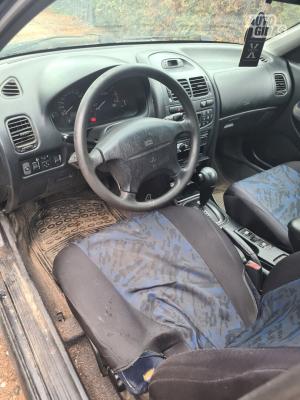 Melns Mitsubishi Carisma 1999 Klaipėda, ar dzinēja tilpumu 1.80 L un nobraukumu 353 tūkst. km par 650 €, foto 6 vietnē AUTOMOTO.COM.LV
