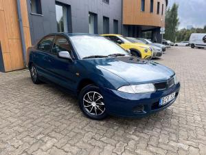 Green Mitsubishi Carisma 1998 in Vilnius, with an engine capacity of 1.60 L and mileage of 123 thousand km for 1290 €, photo 1 on AUTOMOTO.COM.LV