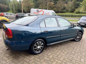 Green Mitsubishi Carisma 1998 in Vilnius, with an engine capacity of 1.60 L and mileage of 123 thousand km for 1290 €, photo 4 on AUTOMOTO.COM.LV