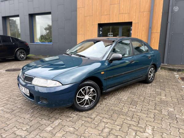 Green Mitsubishi Carisma 1998 in Vilnius, with an engine capacity of 1.60 L and mileage of 123 thousand km for 1290 €, photo 8 on AUTOMOTO.COM.LV